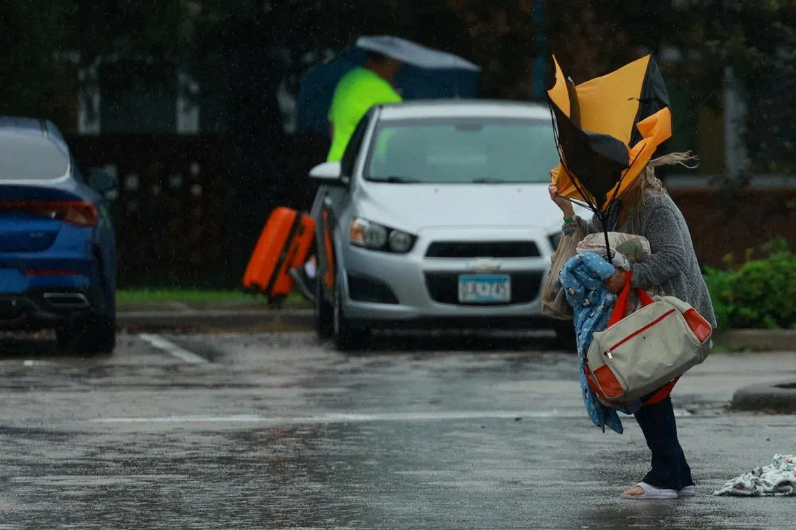 Hurricane Milton weakens as it marches across central Florida, homes ...