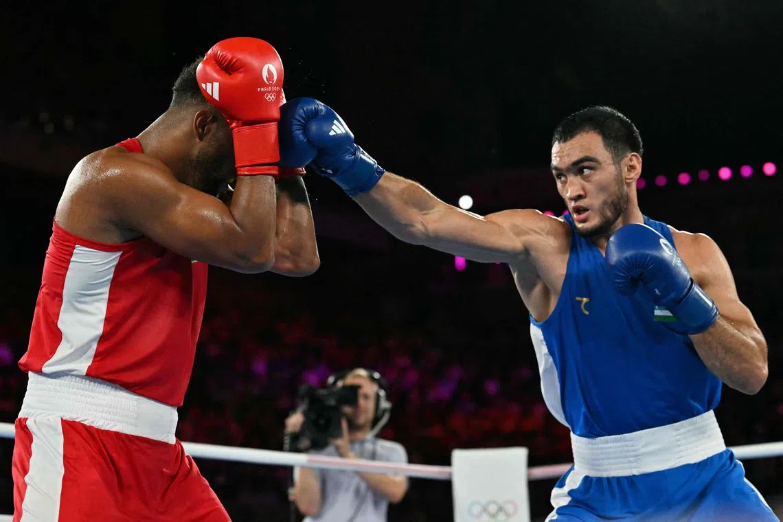 Lazizbek Mullojonov wins heavyweight gold as Uzbekistan lead boxing ...