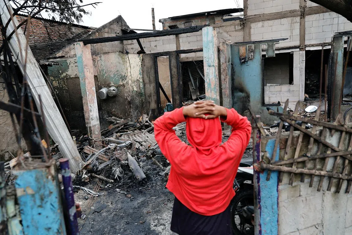 Indonesian residents search charred homes after fuel depot fire kills ...