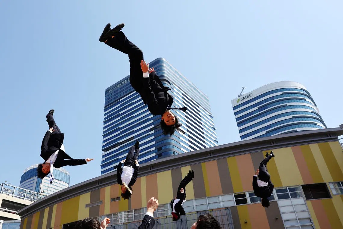 Japanese ‘salarymen’ cheerleading squad inspires, entertains crowds ...
