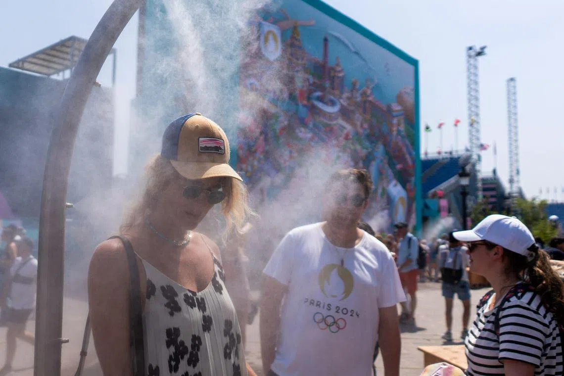 Paris Olympics athletes and fans melt in 'brutal' heat | The Straits Times