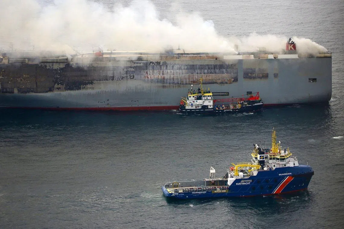 Strong winds delay salvage of burning ship carrying cars off Dutch ...