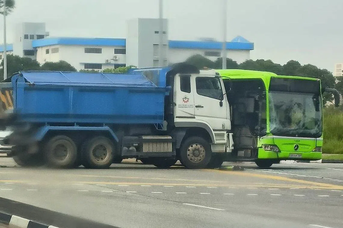 Two bus passengers taken to hospital after collision with truck in ...