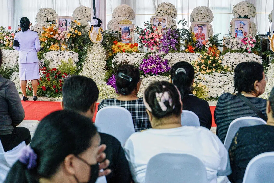 Thai school bus inferno: Flowers and toys at funeral for victims | The ...