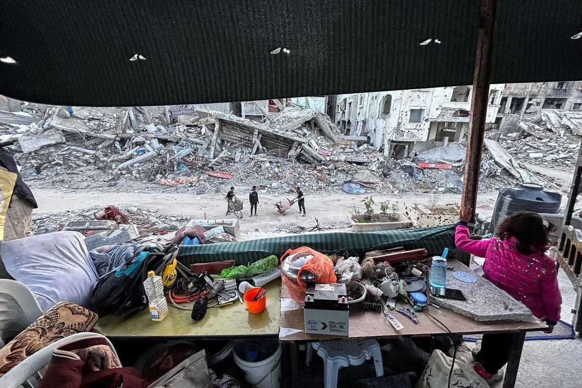 Gaza's displaced break their Ramadan fast with canned food in the ...