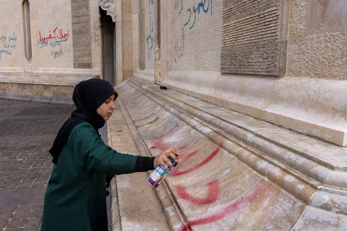 Amid ashes of Assad family's mausoleum, Syrian rebels vow to erase ...
