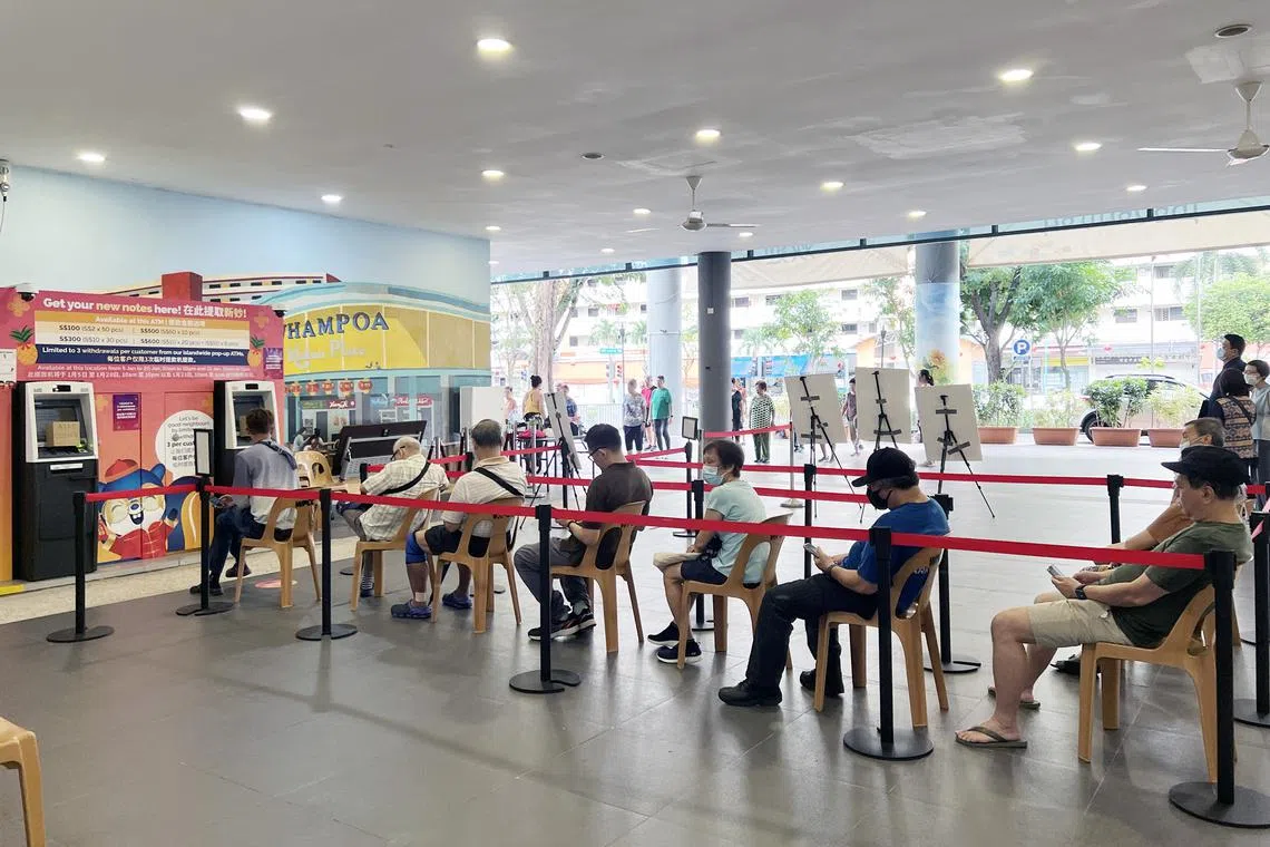 Tradition comes first as many brave long queues at some pop-up ATMs for ...