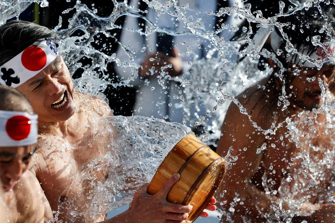 The Week in Pictures: A boy during winter in Kyiv, a protester in ...