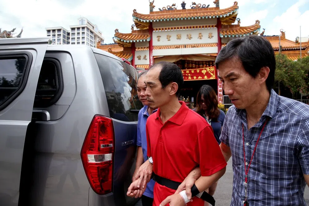 Teck Whye Lane temple murder suspect brought to crime scene | The New Paper
