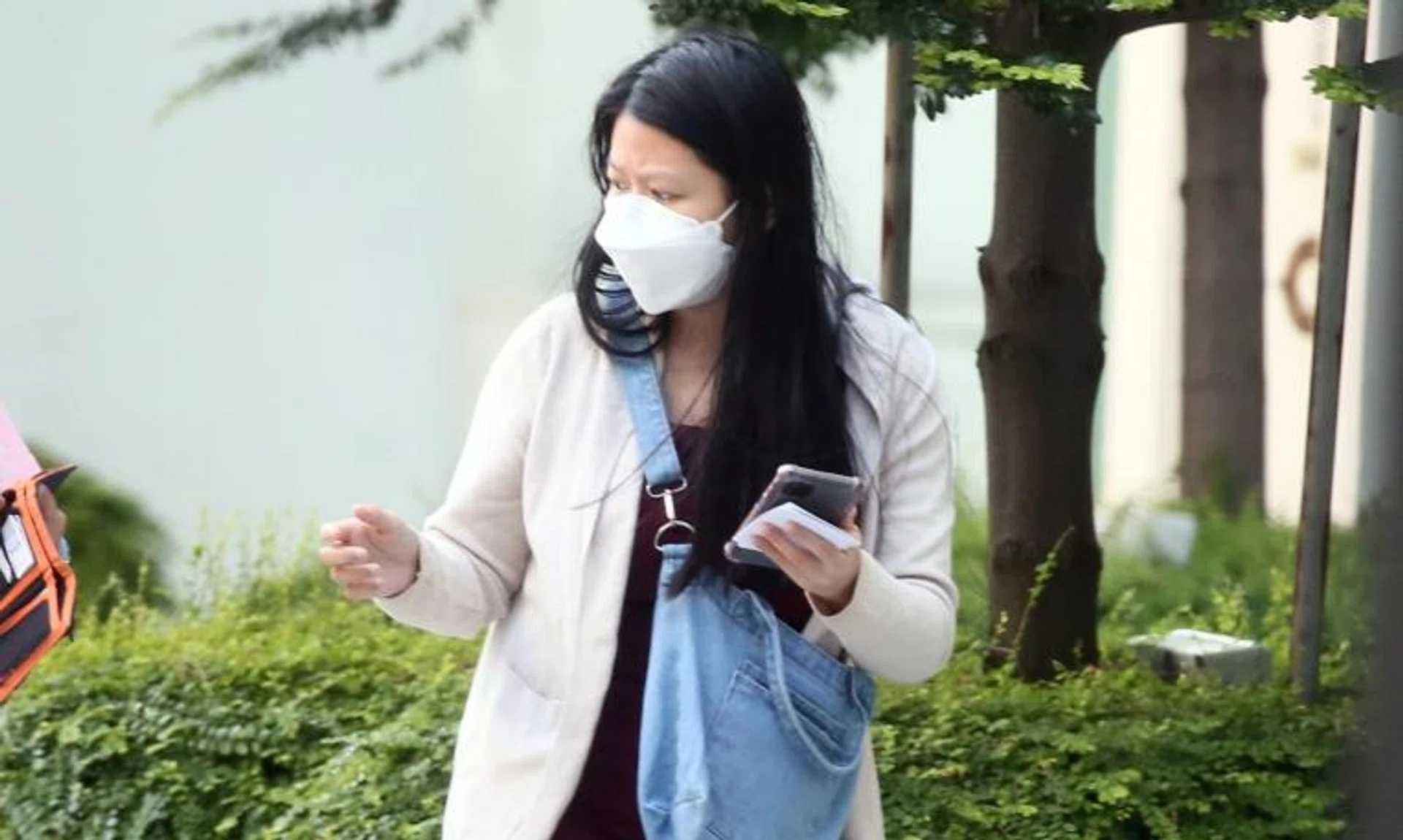 Jail for woman who took orders from scammer and posed as cop to cheat retiree | The New Paper