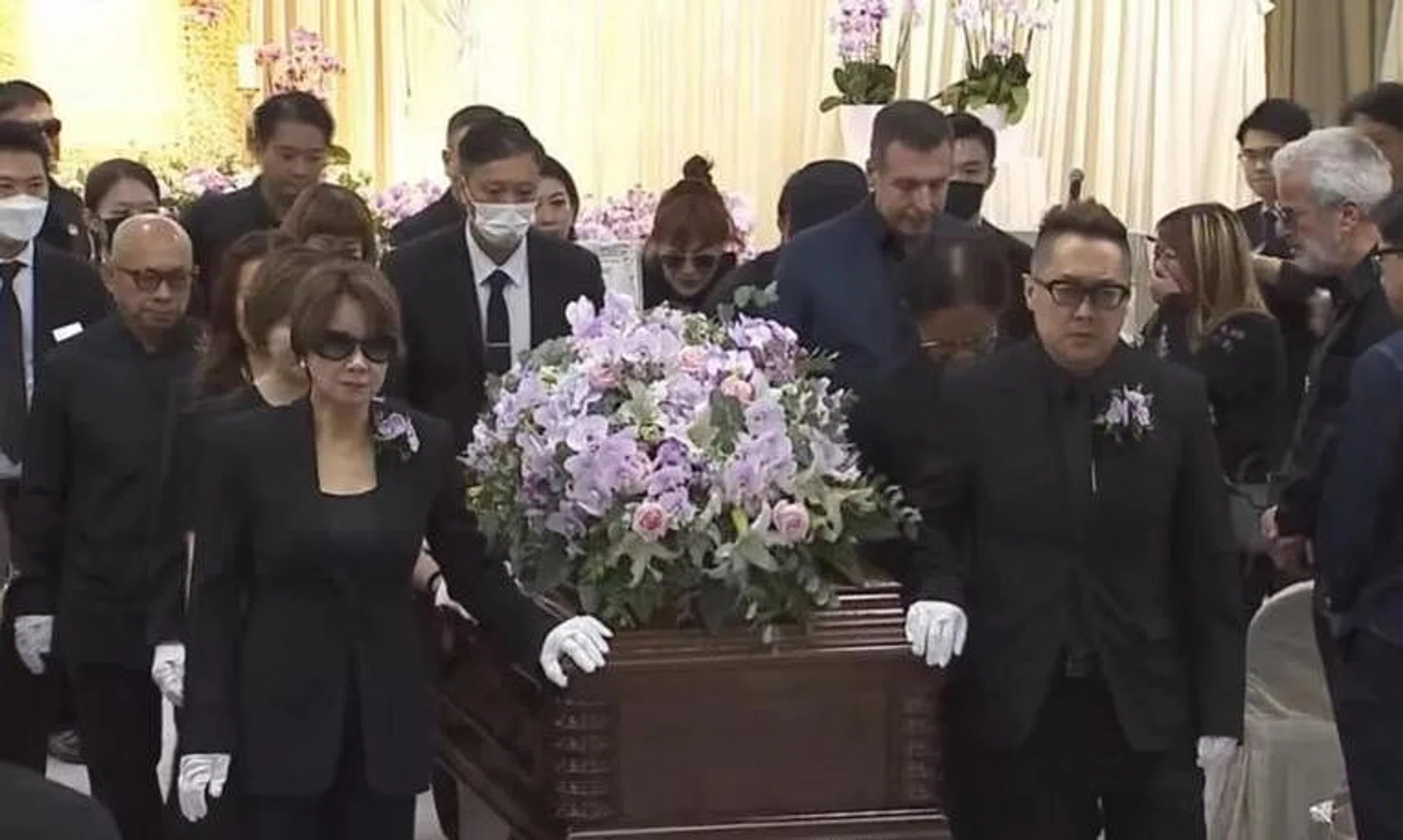 Late singer Coco Lee's estranged husband says at crematorium he loved ...