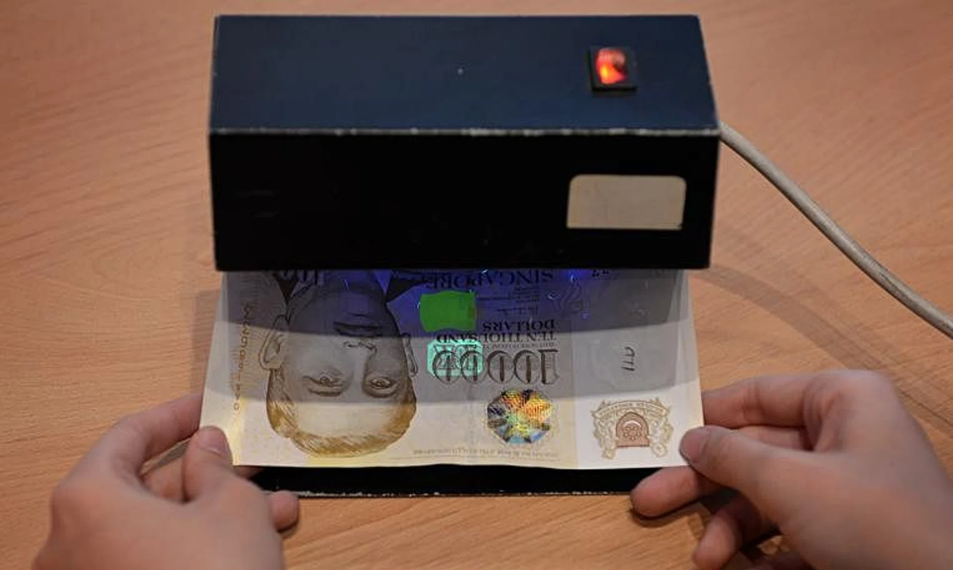 65-year-old man convicted over trying to deposit 3 fake $10,000 notes ...