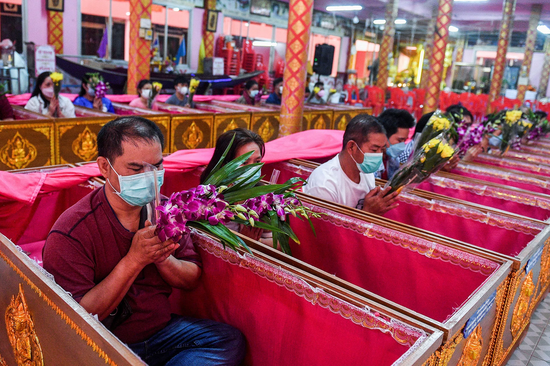 Devotees climb into coffins for Thailand's strangest New Year ceremony ...