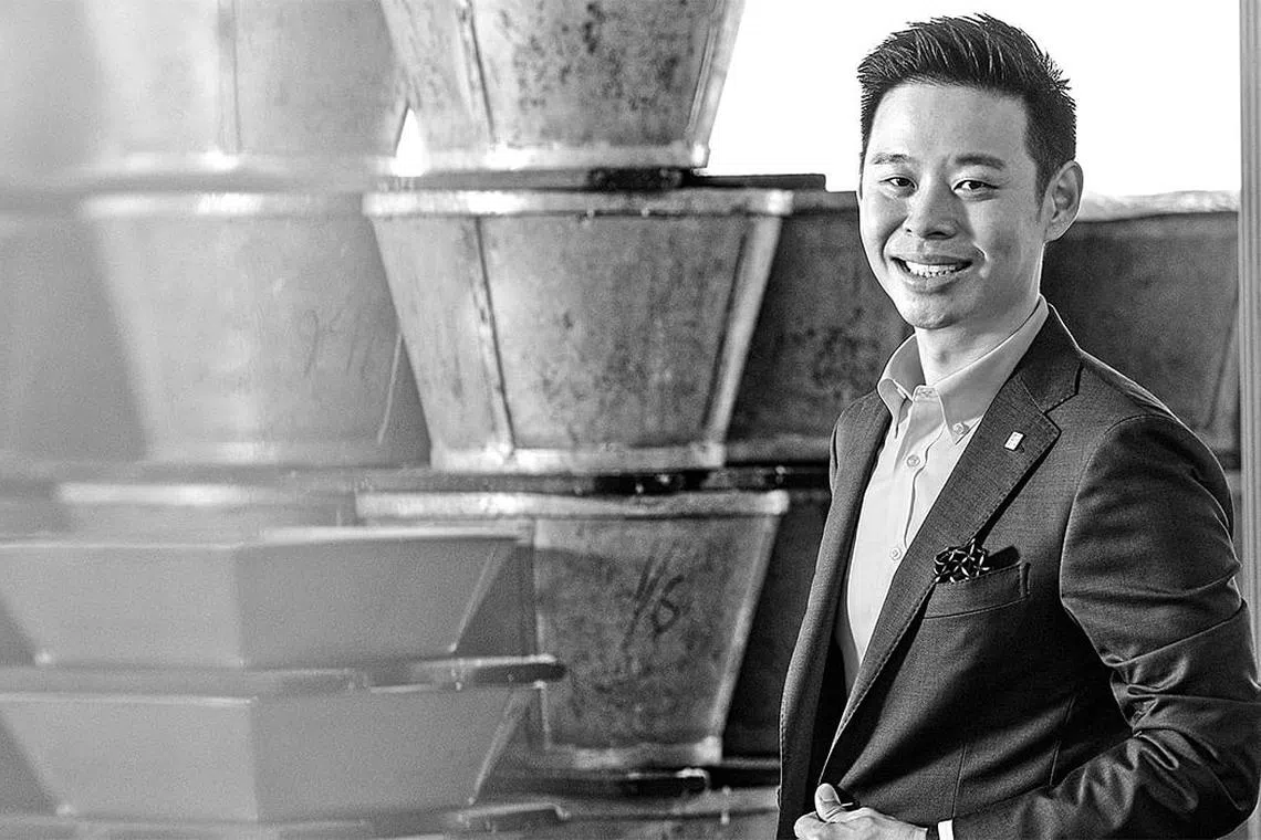 John Cheng, director of Cheng Yew Heng Candy Factory, imparts advice to ...